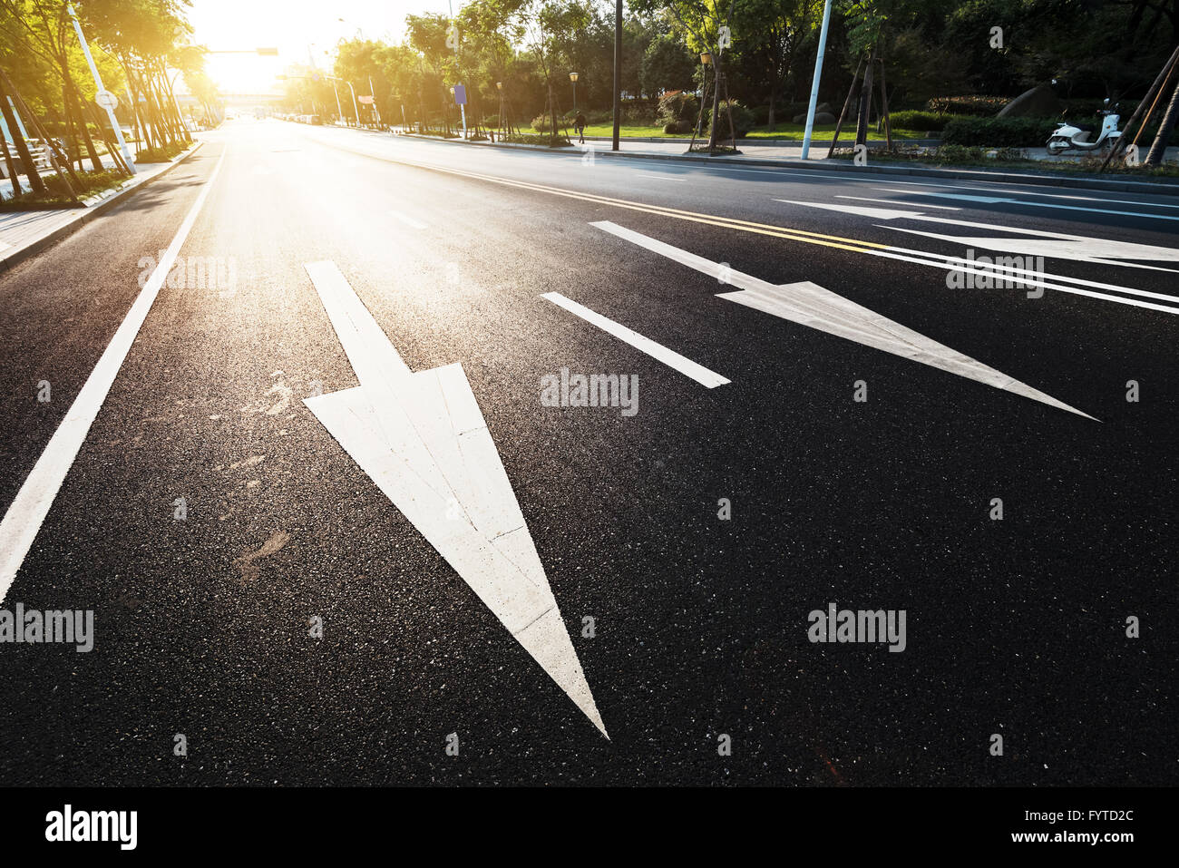 sunlight and empty asphalt road with traffic sign Stock Photo - Alamy