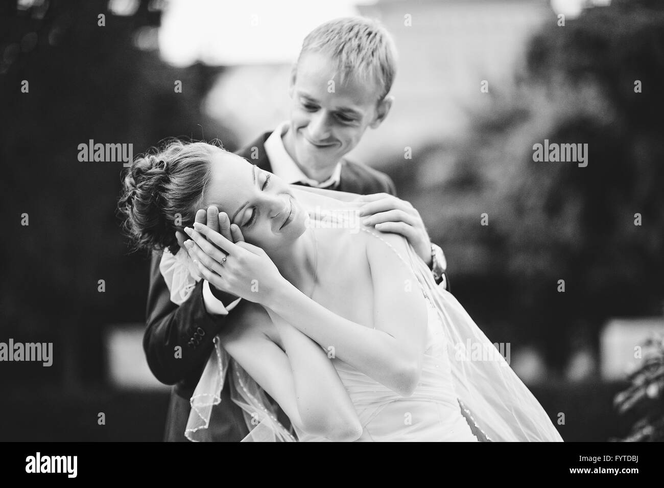 bride clung to the hands of man Stock Photo - Alamy