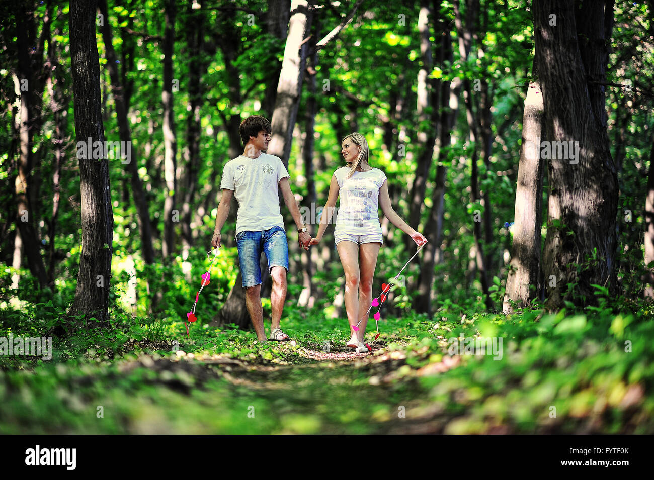 Romantic couple on forest Stock Photo - Alamy