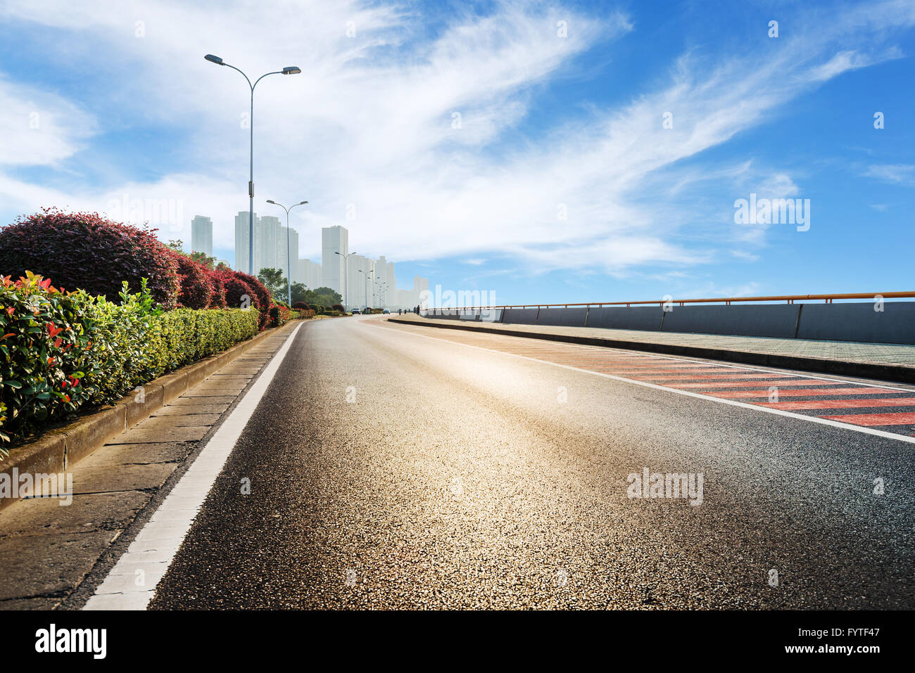 skyline and empty road to modern building Stock Photo - Alamy