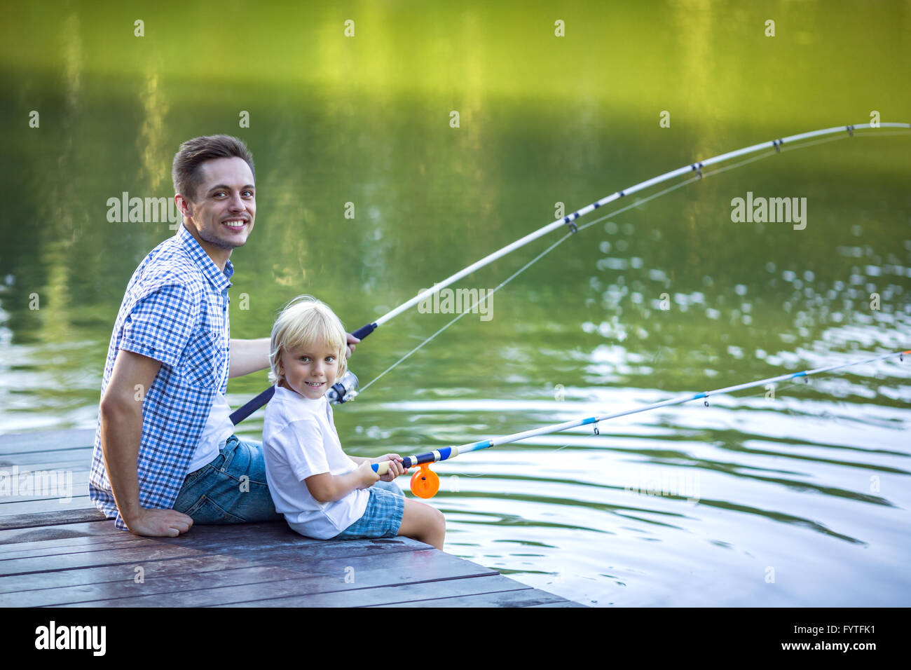 Child catching fish hi-res stock photography and images - Alamy