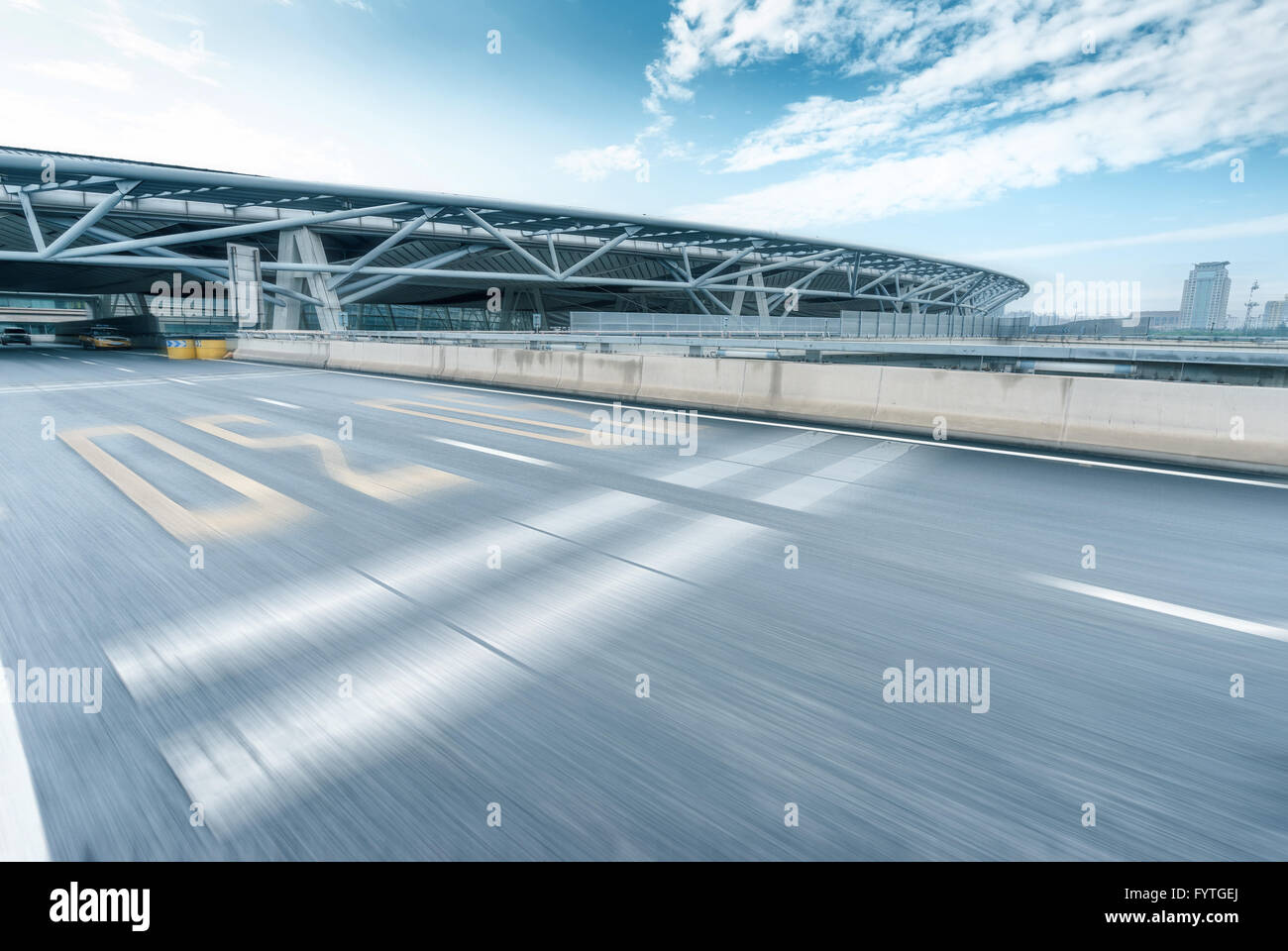 skyline and road through buildings Stock Photo - Alamy