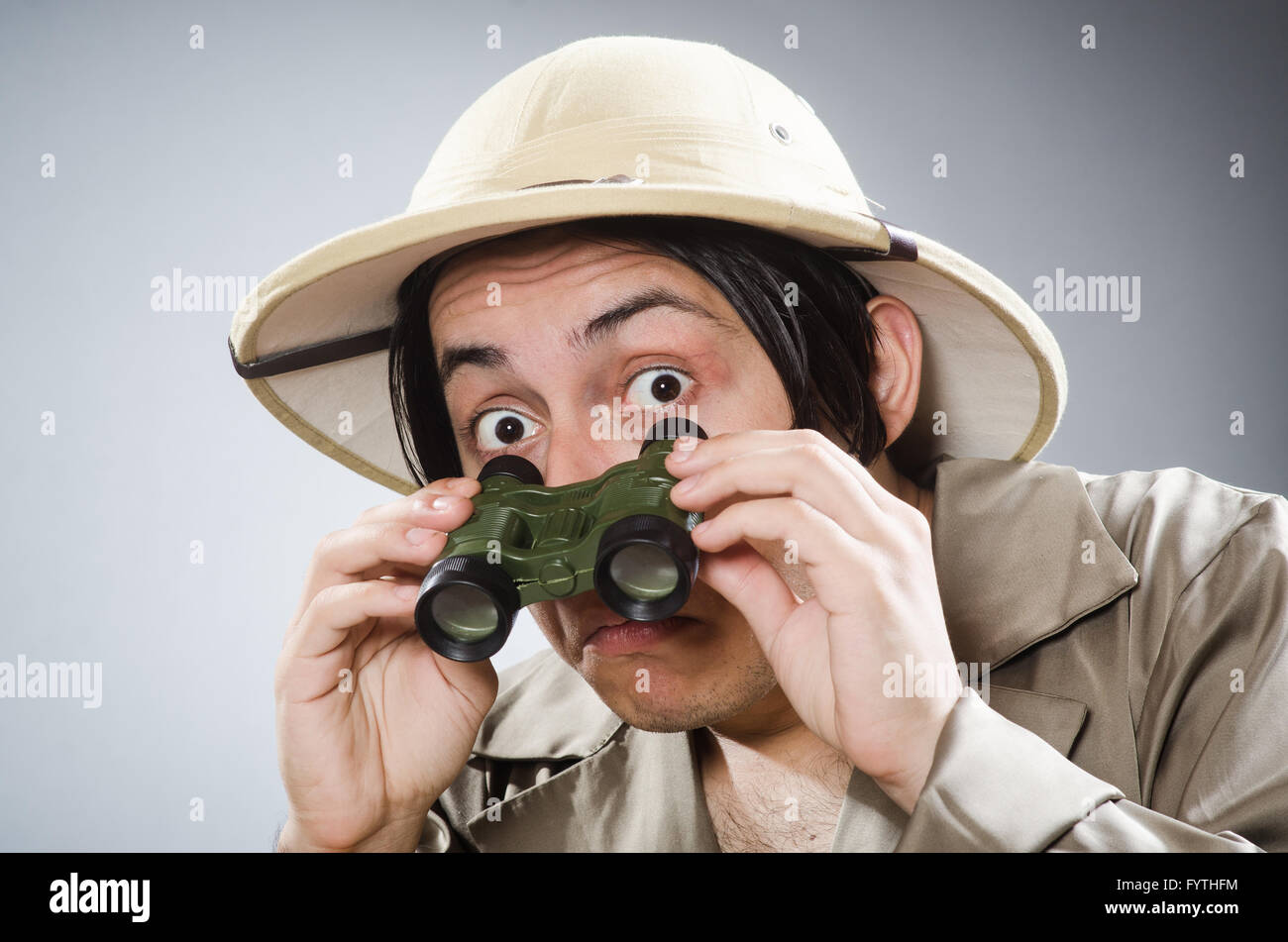 Funny safari traveller in travelling concept Stock Photo - Alamy
