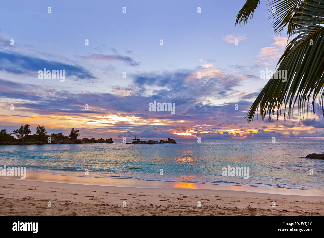 Seychelles tropical beach at sunset Stock Photo - Alamy