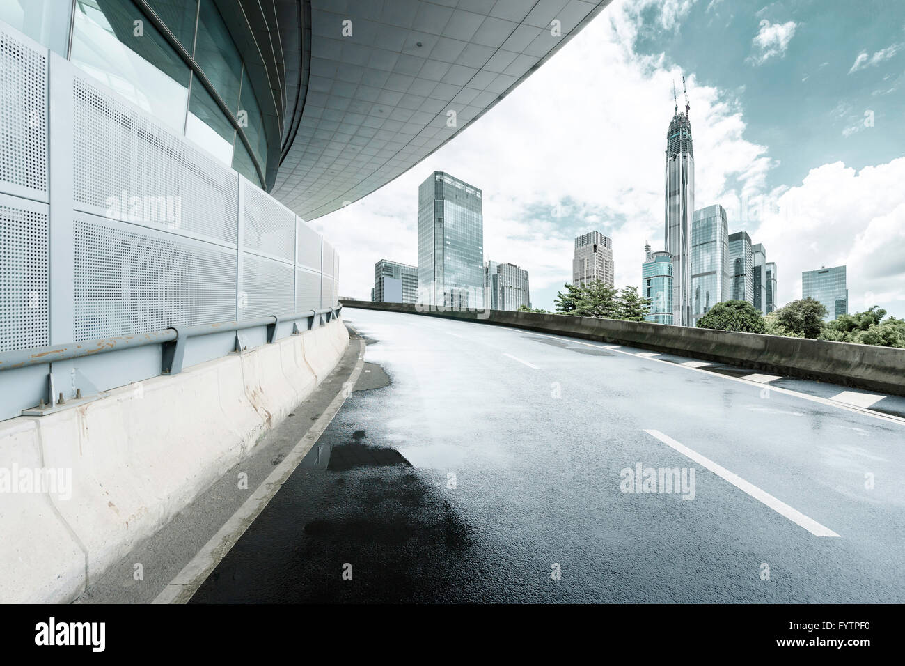 empty road and modern building cloudy skyline Stock Photo - Alamy