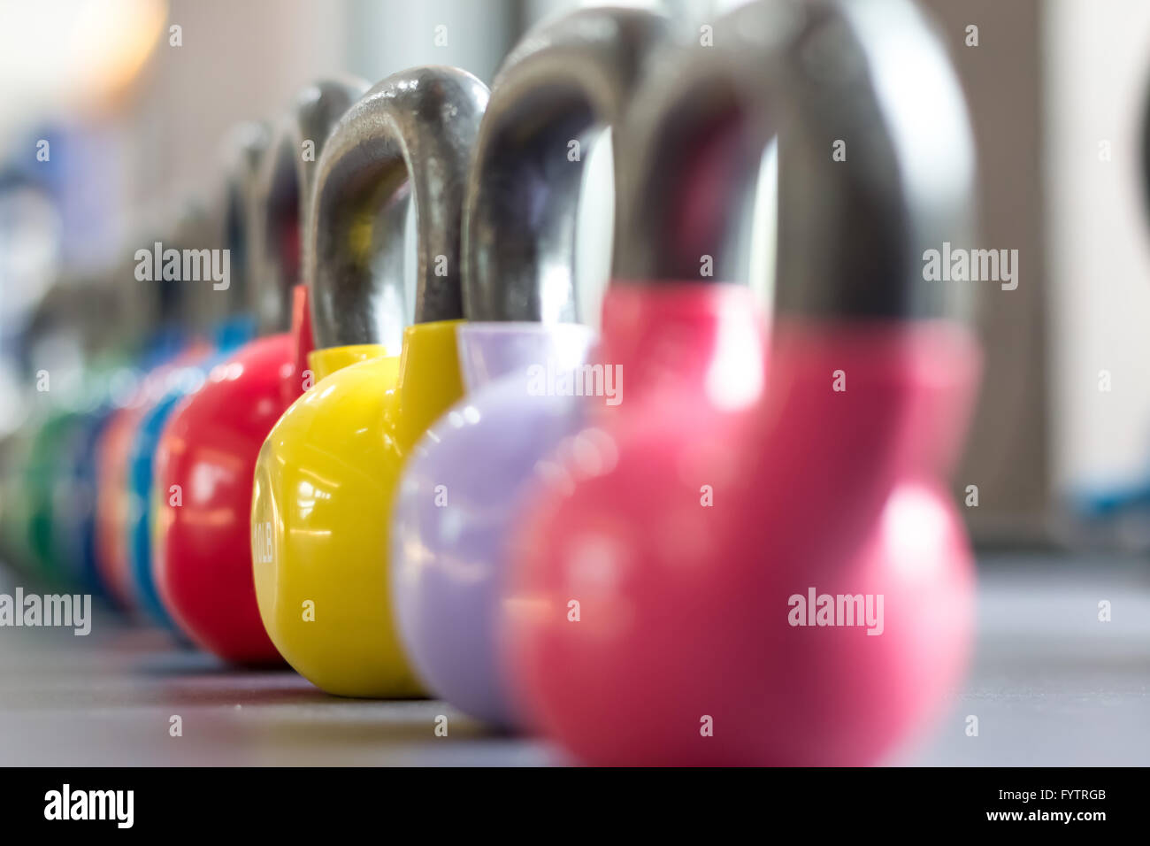colorful kettle bell on table Stock Photo - Alamy