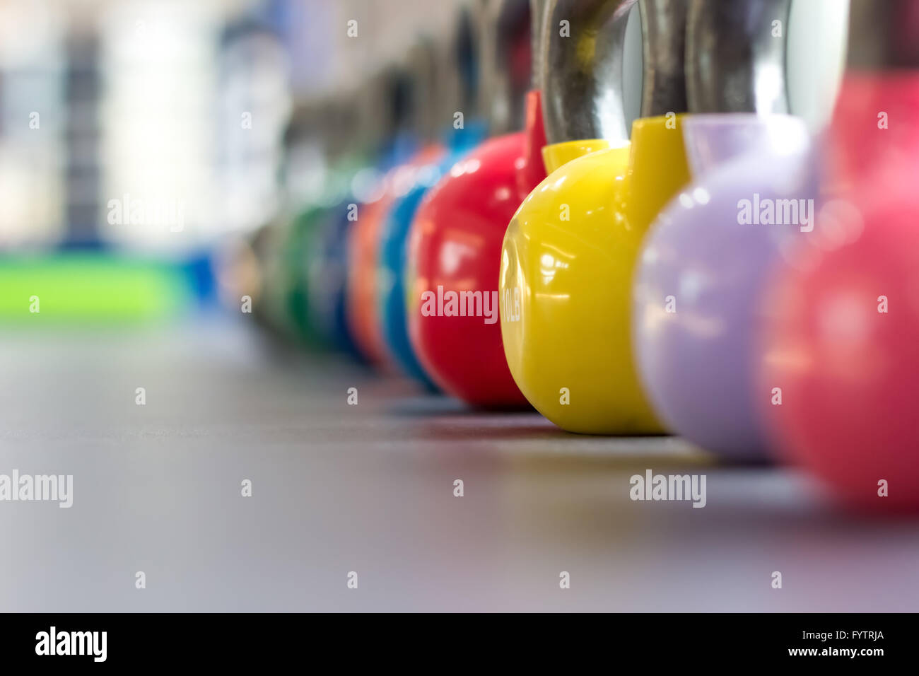 colorful kettle bell on table Stock Photo - Alamy