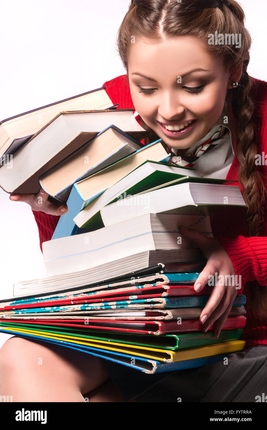 girl standing with a bunch of books Stock Photo - Alamy
