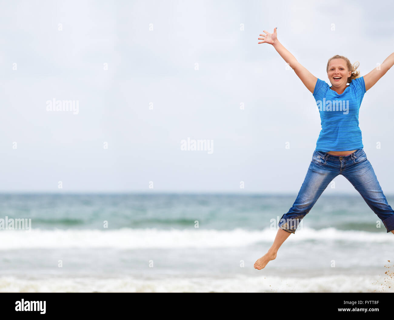 Positive girl jumping hi-res stock photography and images - Alamy