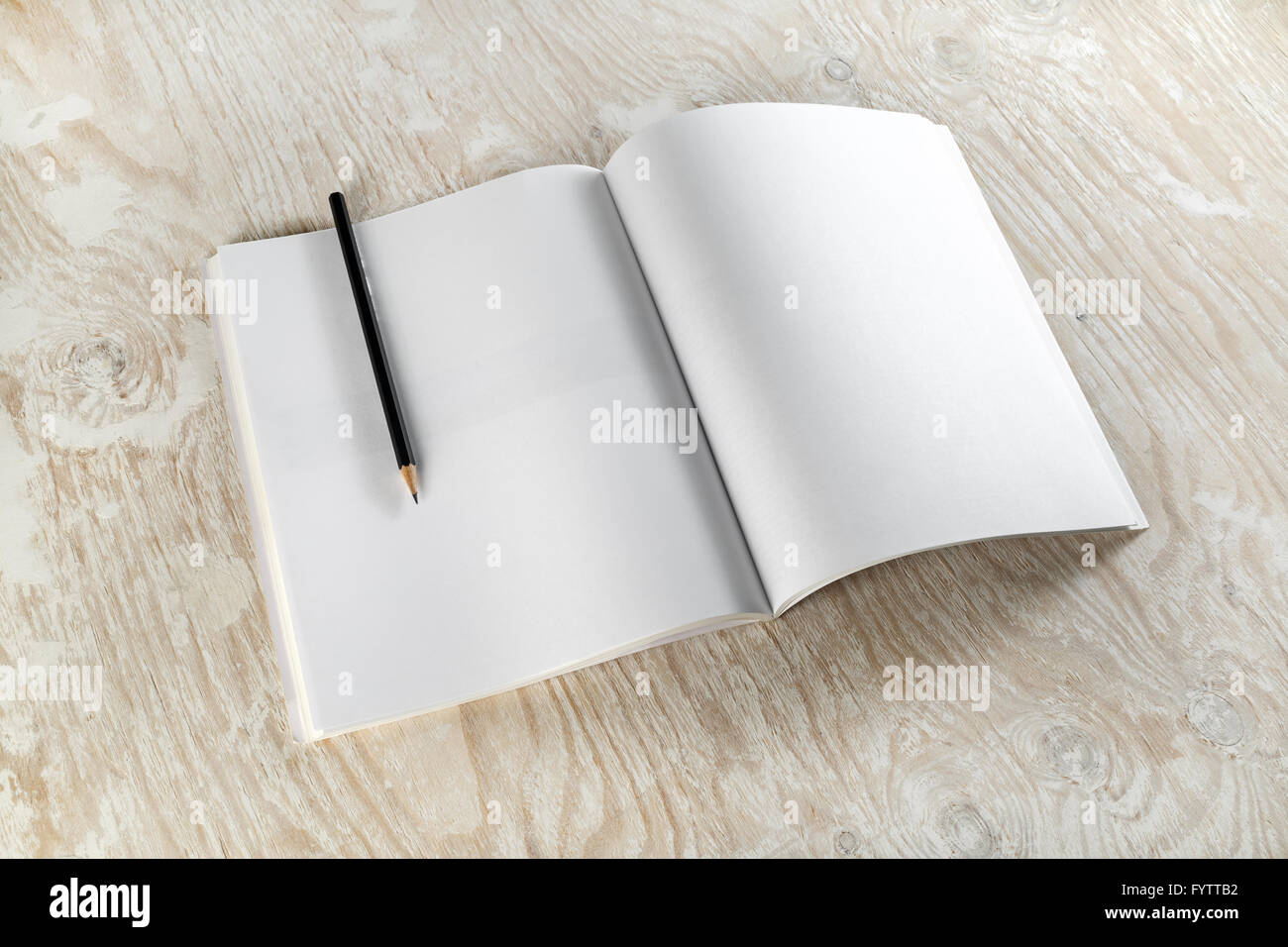 Brochure with a pencil Stock Photo - Alamy