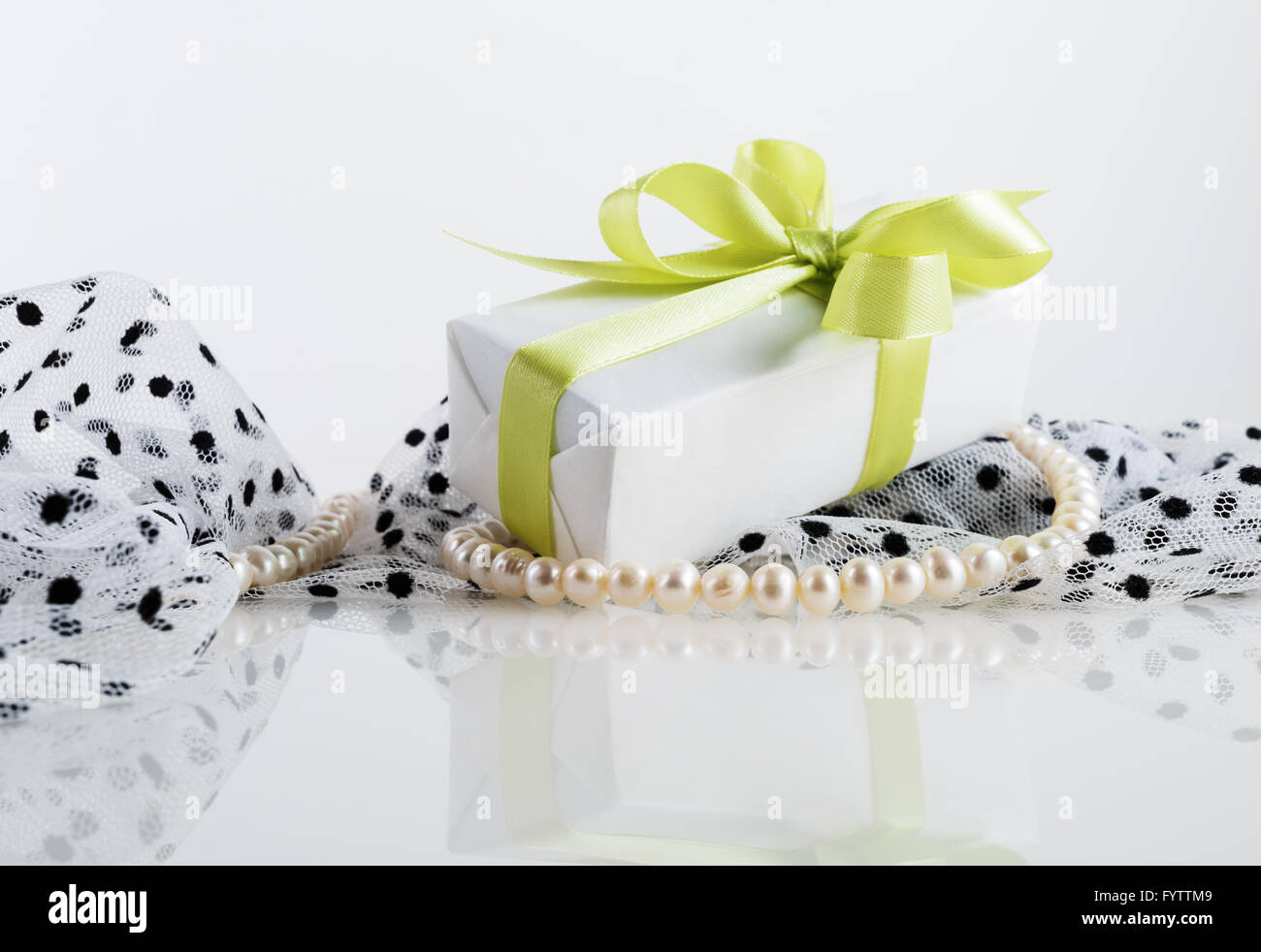 Gift box and pearls Stock Photo - Alamy