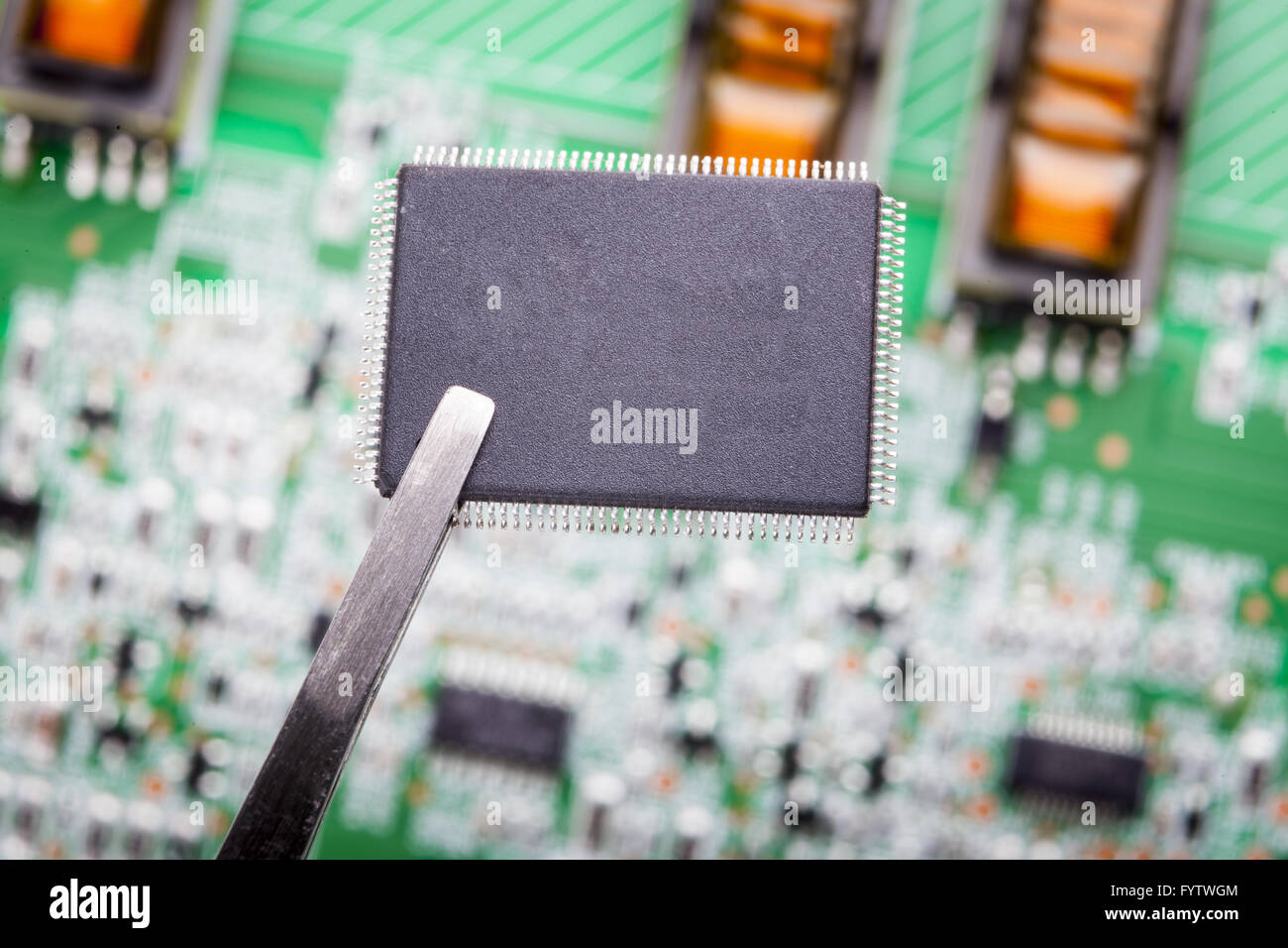 Cpu chip tweezers hi-res stock photography and images - Alamy