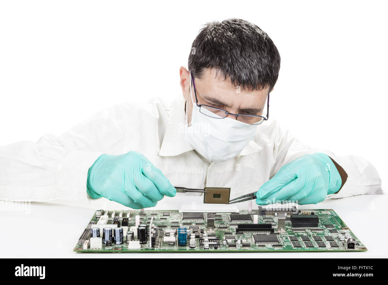 Male technician holding computer chip hi-res stock photography and ...