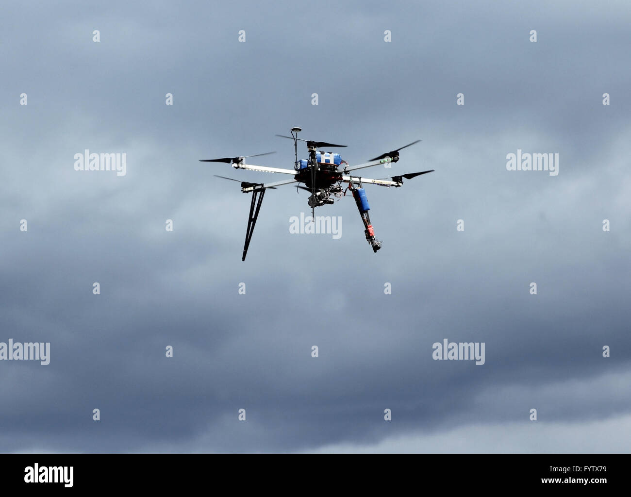 Flying drone in the sky with mounted digital camera Stock Photo - Alamy