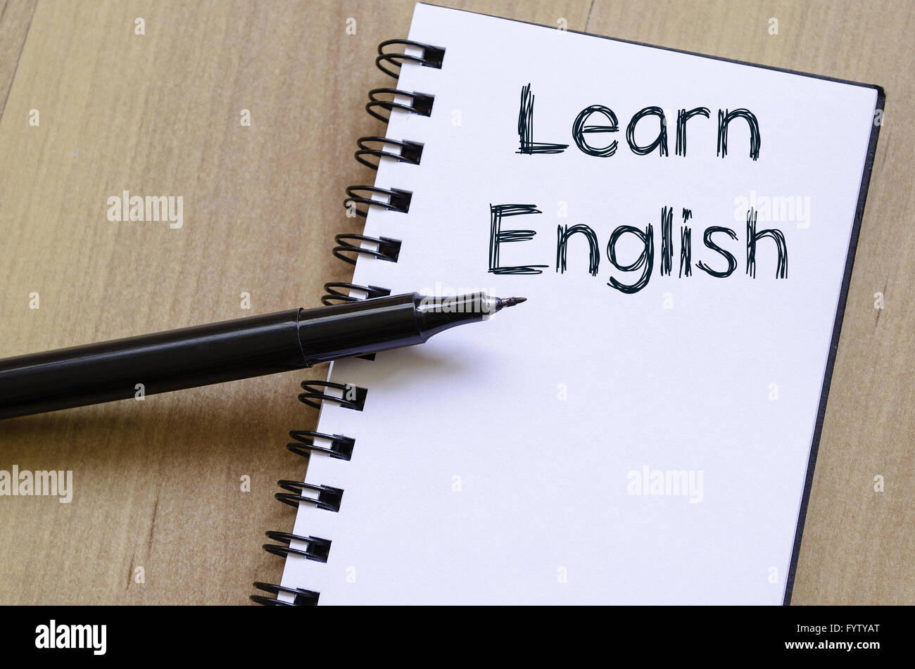 Learn english write on notebook Stock Photo - Alamy