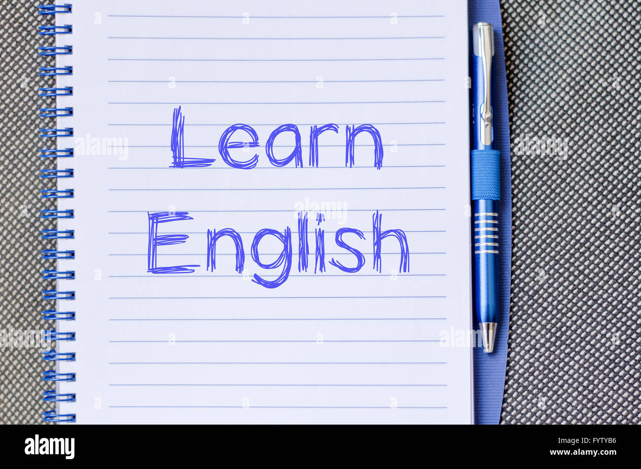 Learn english write on notebook Stock Photo - Alamy