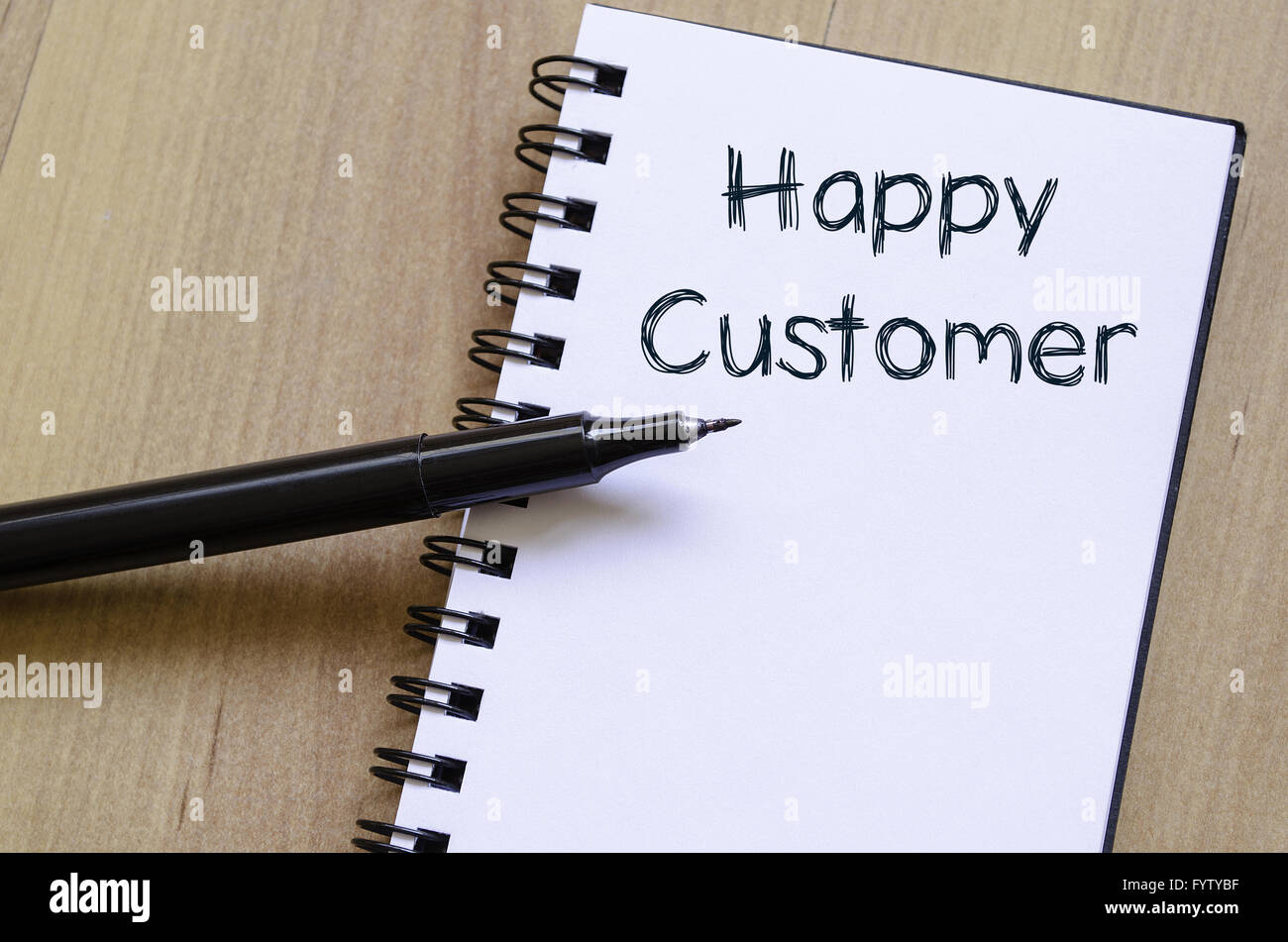 Happy customer write on notebook Stock Photo - Alamy