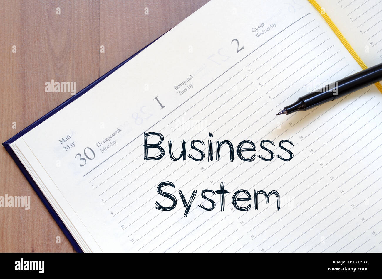 Business system write on notebook Stock Photo - Alamy