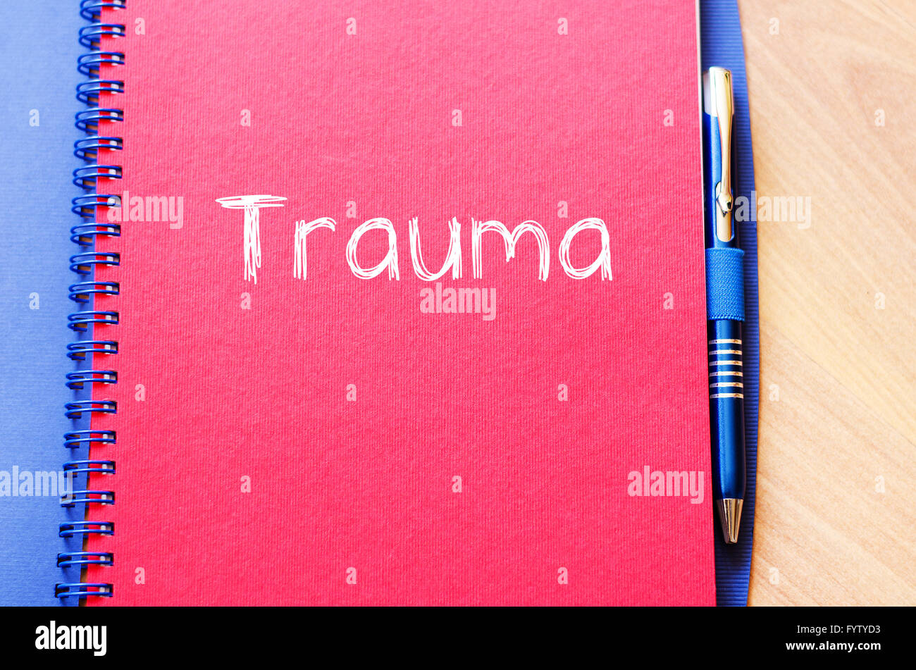 Trauma write on notebook Stock Photo - Alamy