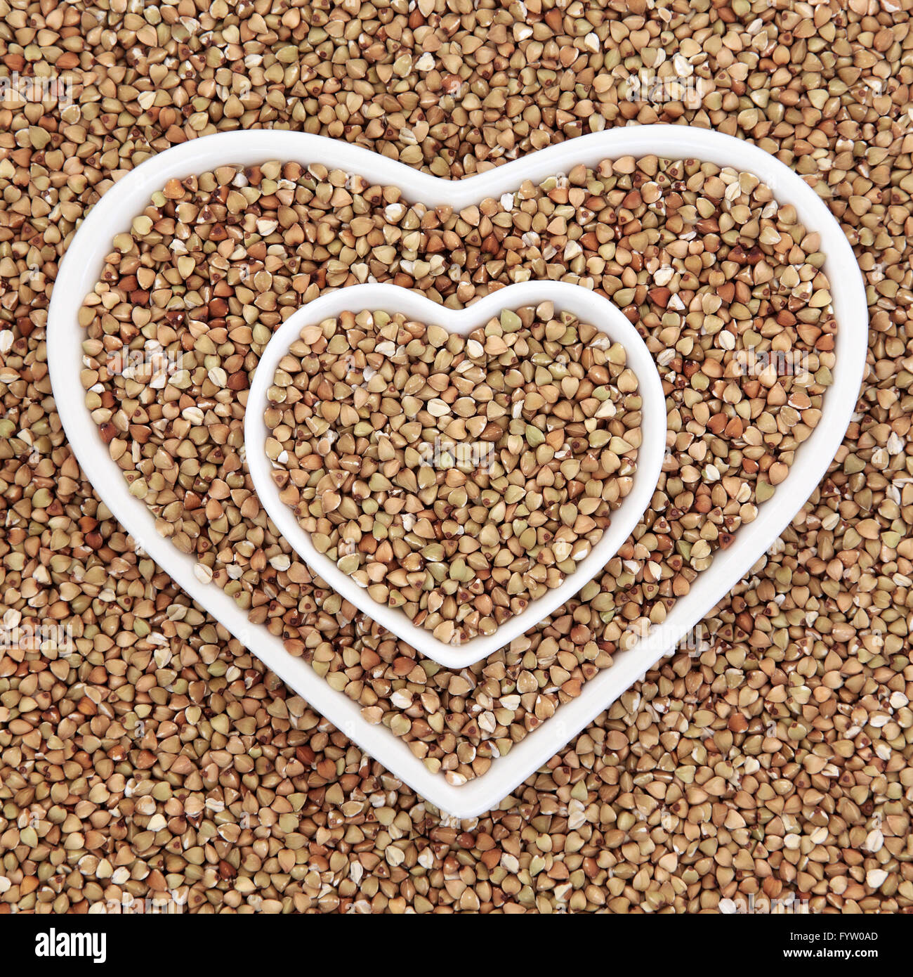 Buckwheat super food in heart shaped bowls forming an abstract ...