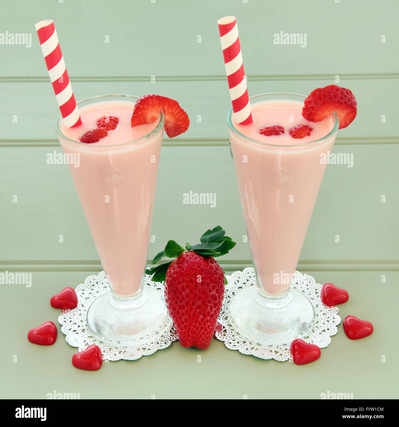 Healthy strawberry smoothie drinks with fresh fruit and heart shaped ...