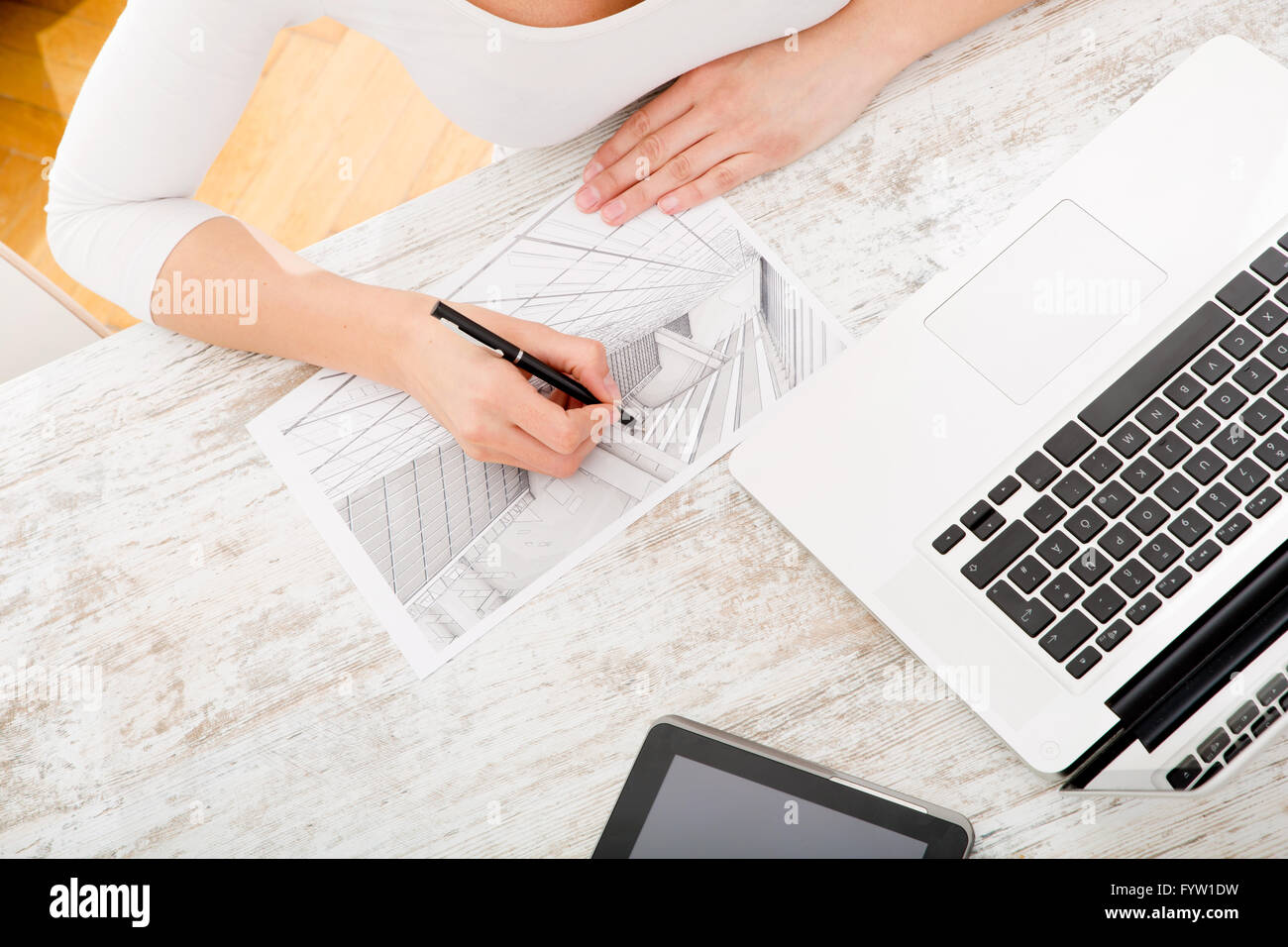 Woman drawing a blueprint Stock Photo - Alamy