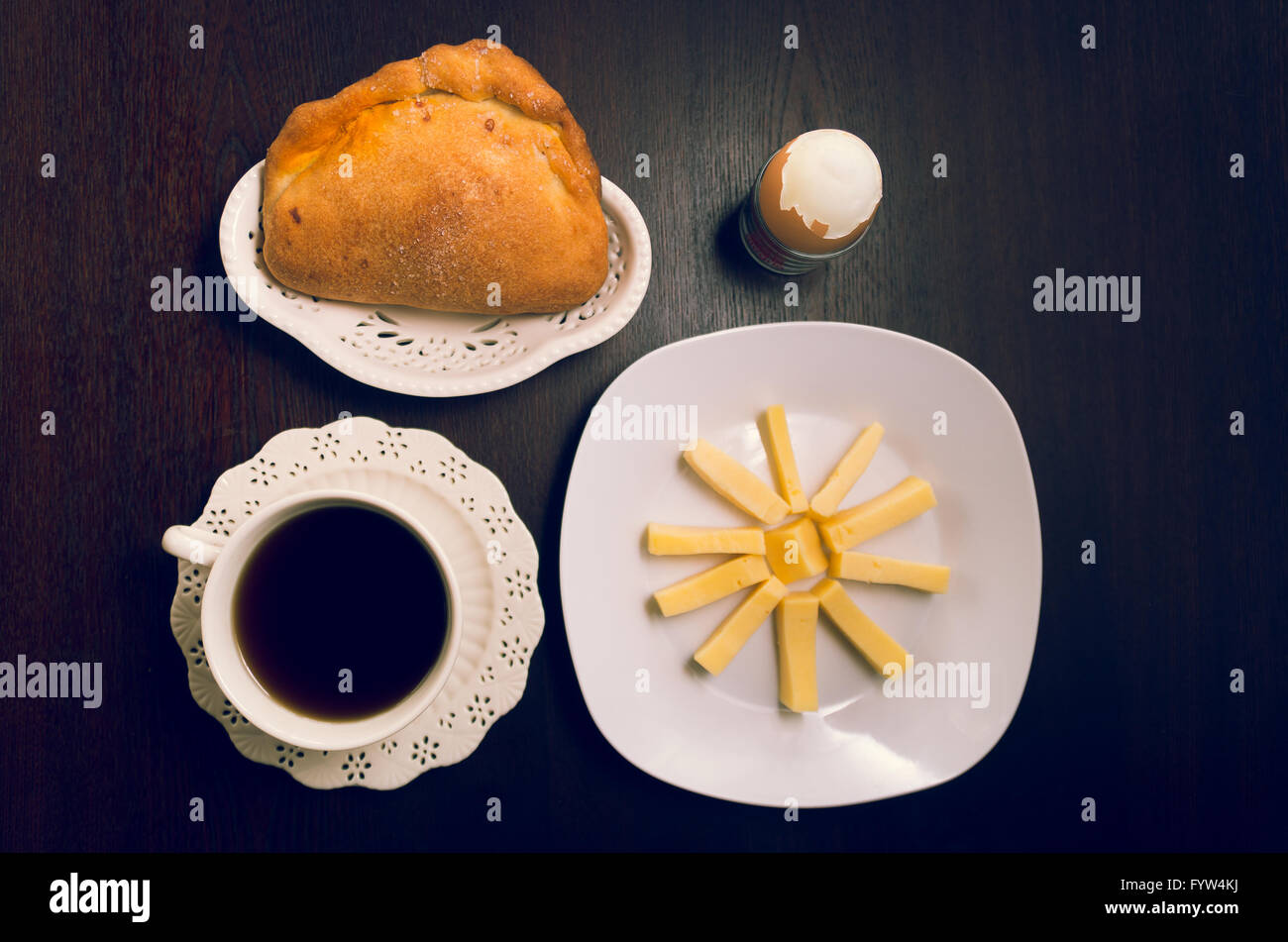 latin inspired breakfast on dark wood table including slices of cheese ...