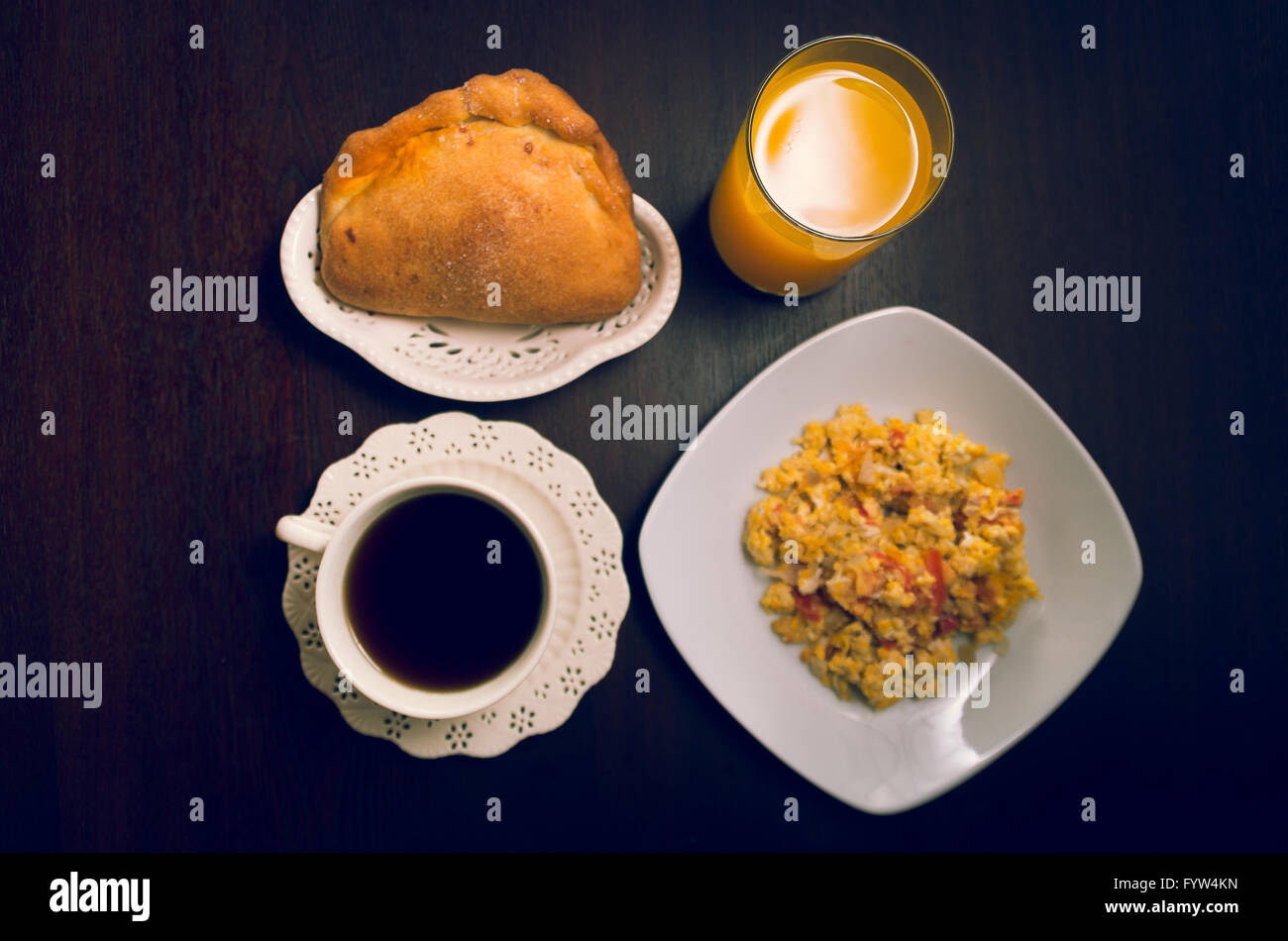 latin inspired breakfast on dark wood table including scrambled eggs ...