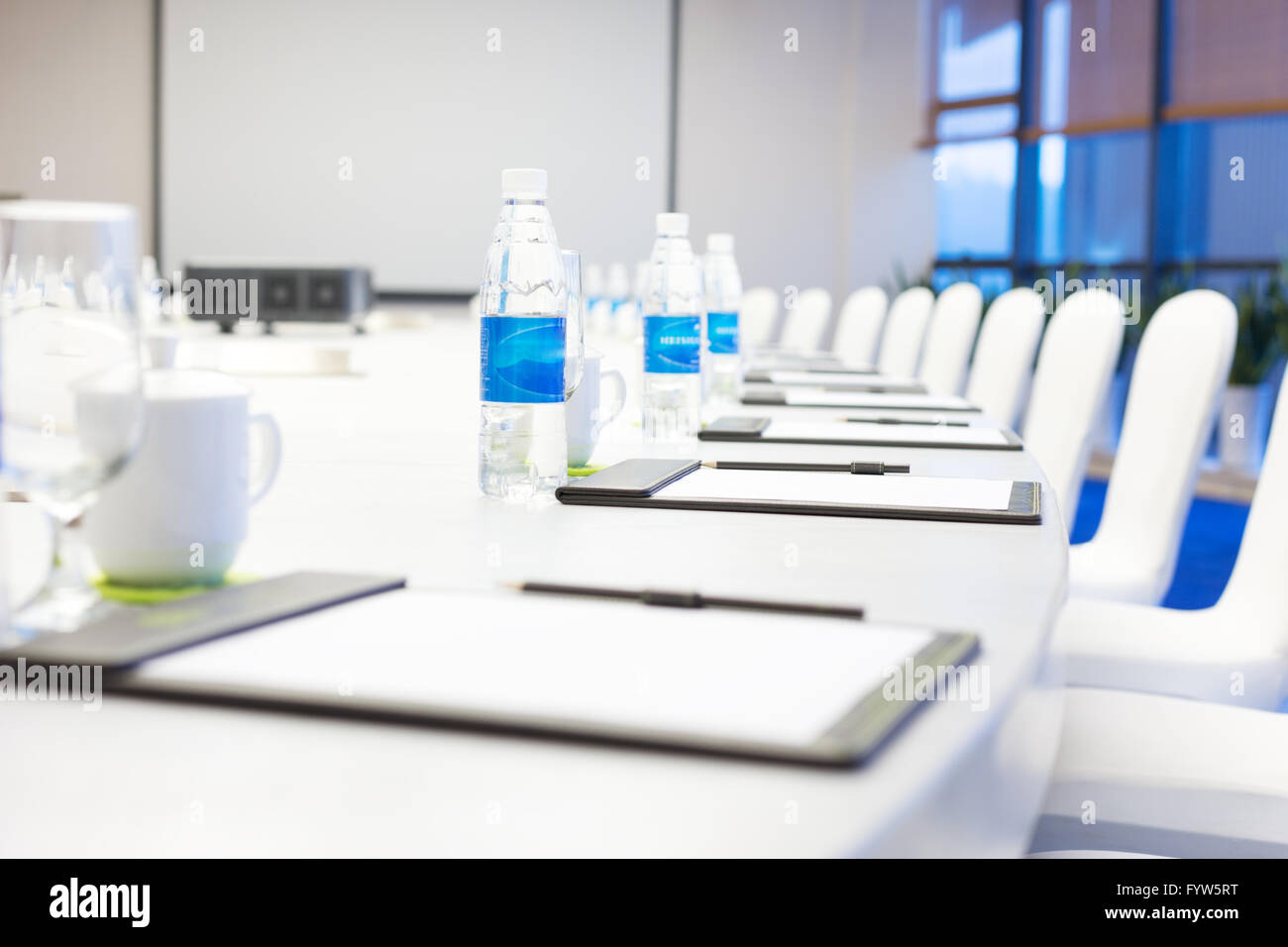 white big table in modern meeting room Stock Photo - Alamy