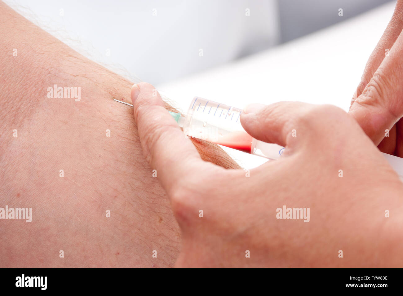 doc makes the patient an injection into a vein Stock Photo - Alamy