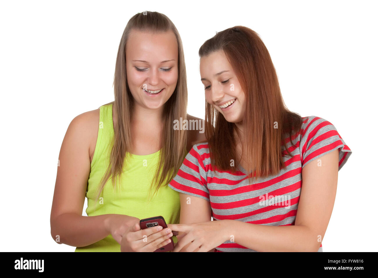 Portrait of lovely young women using mobile phone together Stock Photo ...
