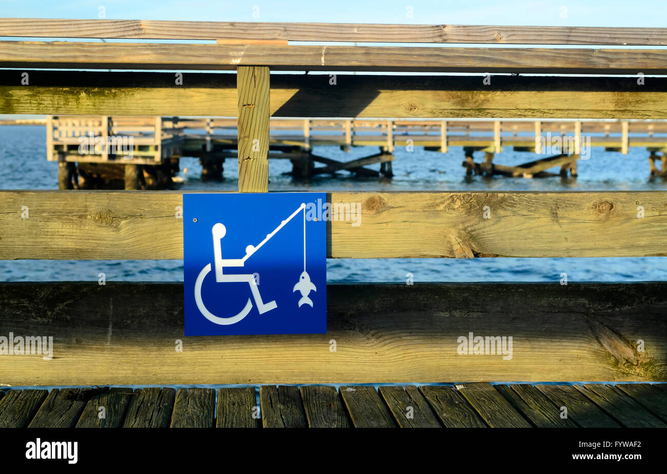 Fishing sign for disabled on pier Stock Photo - Alamy