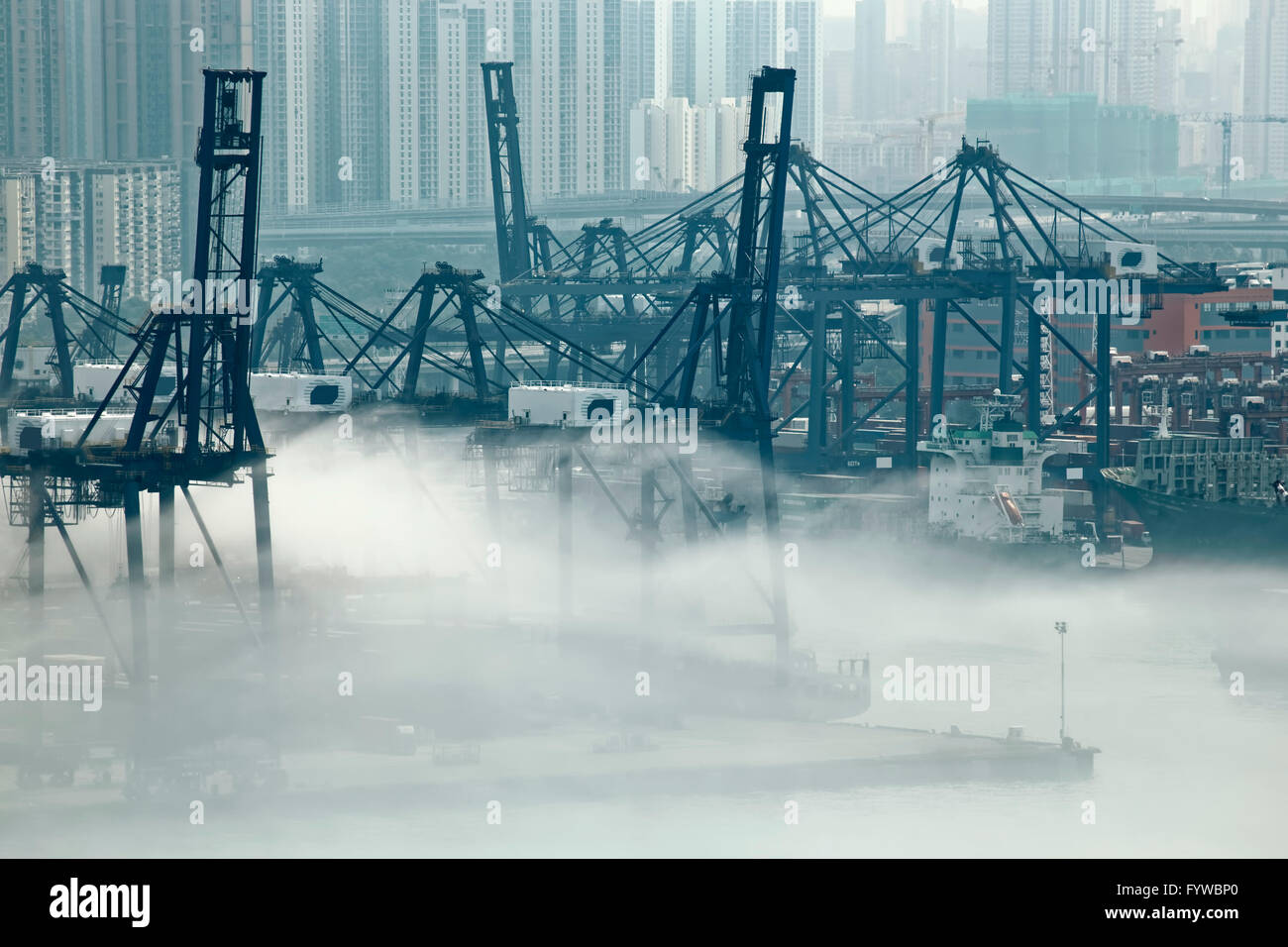 Hong Kong cargo port in mist Stock Photo - Alamy