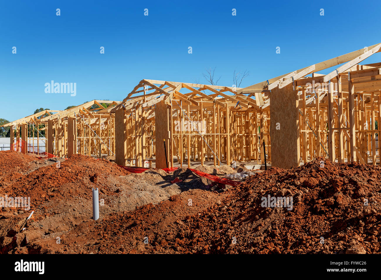 new suburban homes currently under construction in row Stock Photo - Alamy