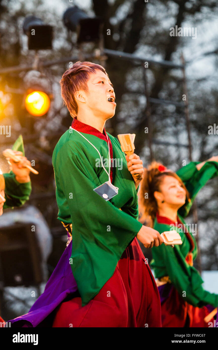Close up of Japanese man dancer in green yukata jacket, dancing at ...
