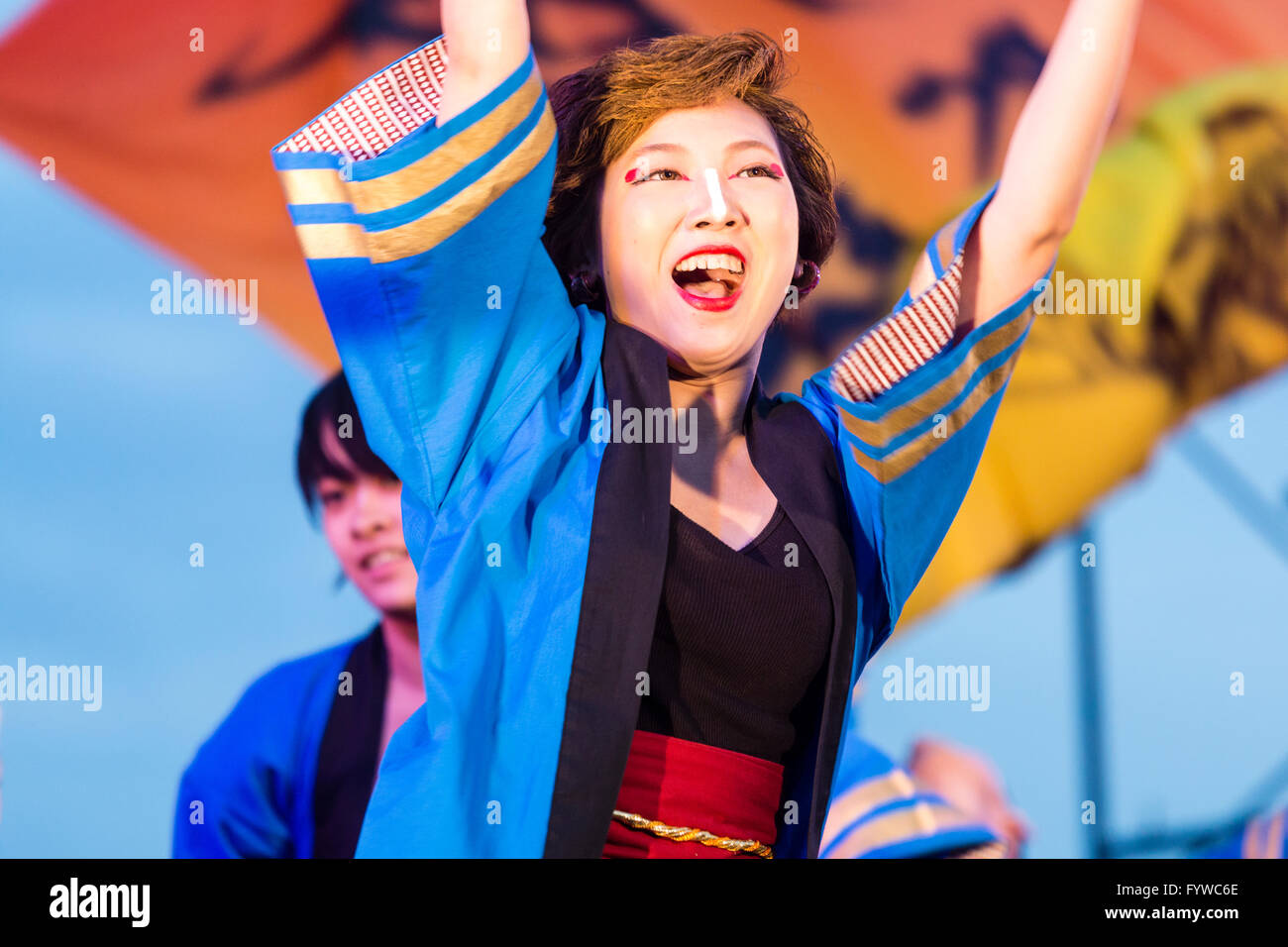 Close up of Japanese woman dancer in blue yukata jacket, dancing at ...