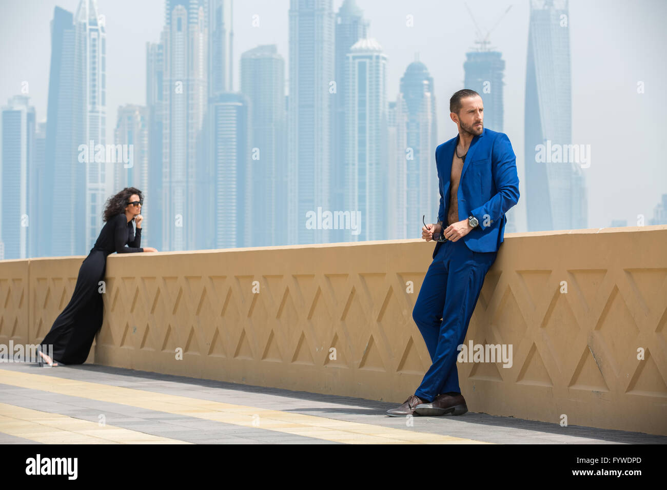 Couple on the background of skyscrapers Stock Photo - Alamy