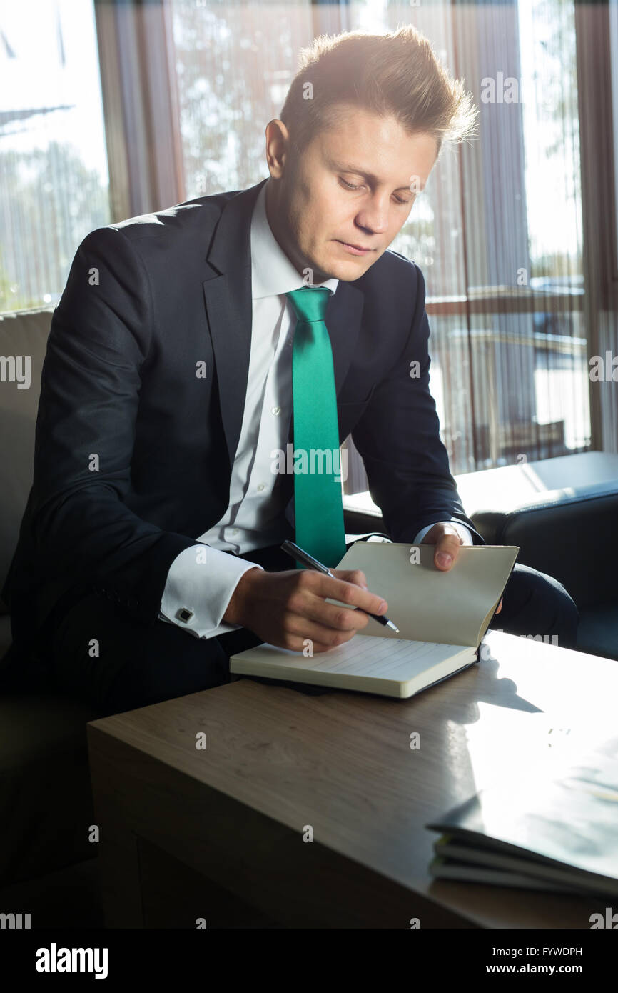 Man with notebook Stock Photo - Alamy