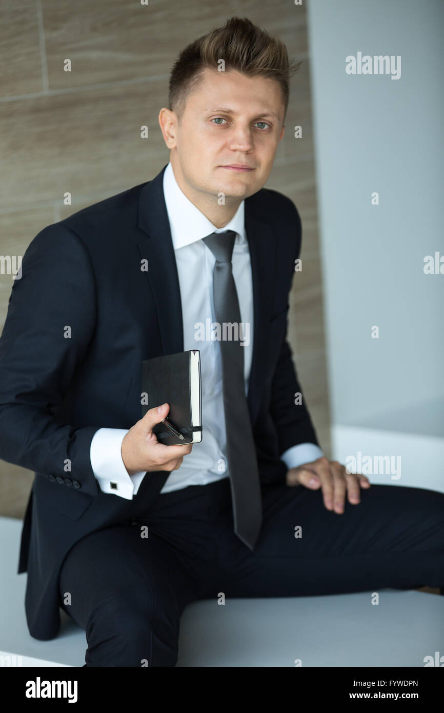 Man with notebook Stock Photo - Alamy