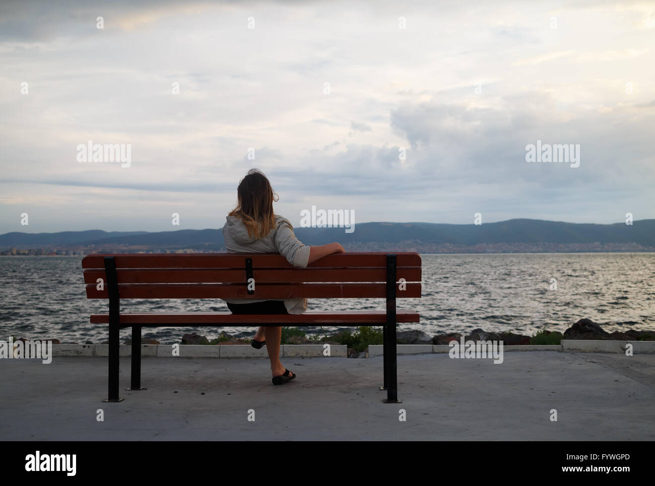 Sitting on a bench Stock Photo - Alamy