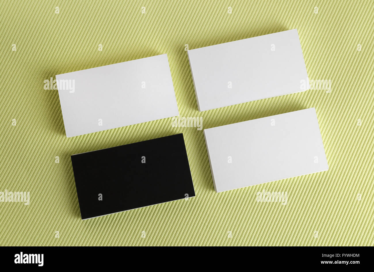 Business cards on a green background Stock Photo - Alamy