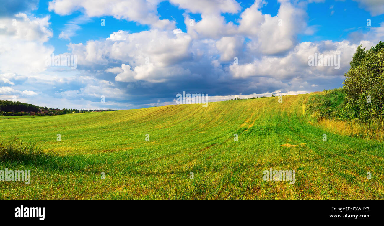Green hill and sky Stock Photo - Alamy