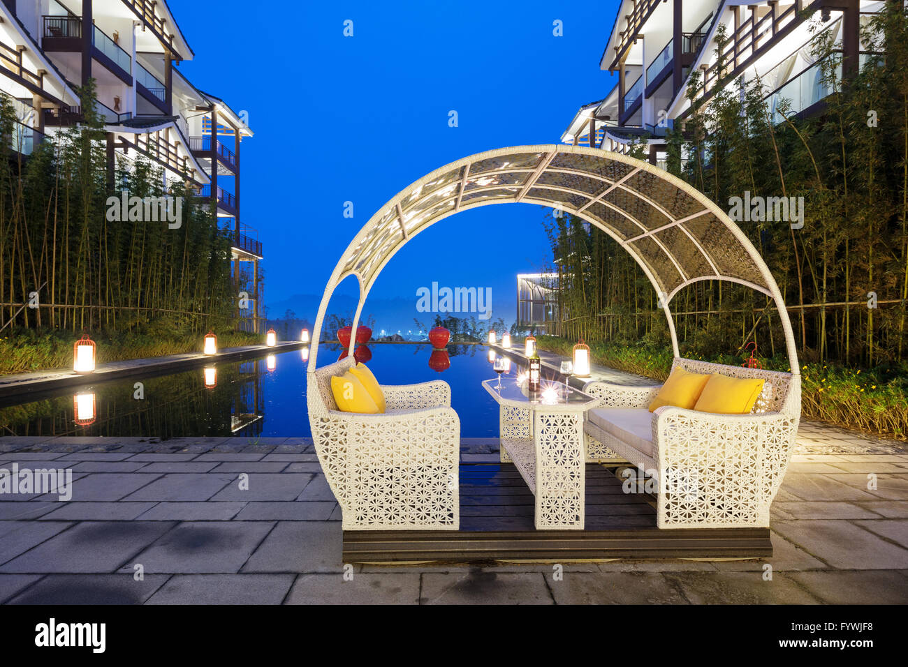 rocking chair on ground front of architecture Stock Photo - Alamy