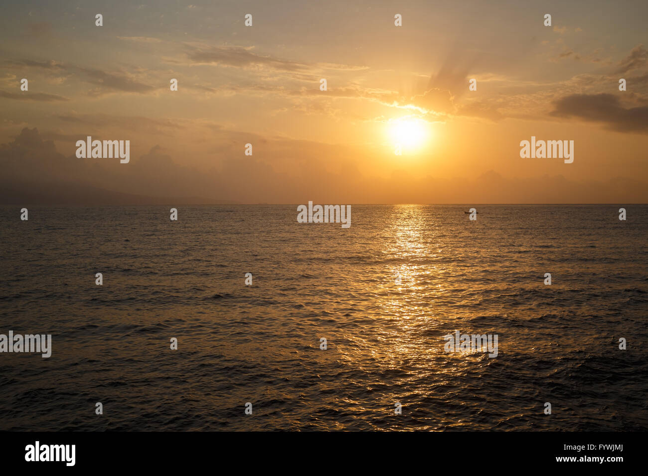 Golden sun rising over ocean hi-res stock photography and images - Alamy