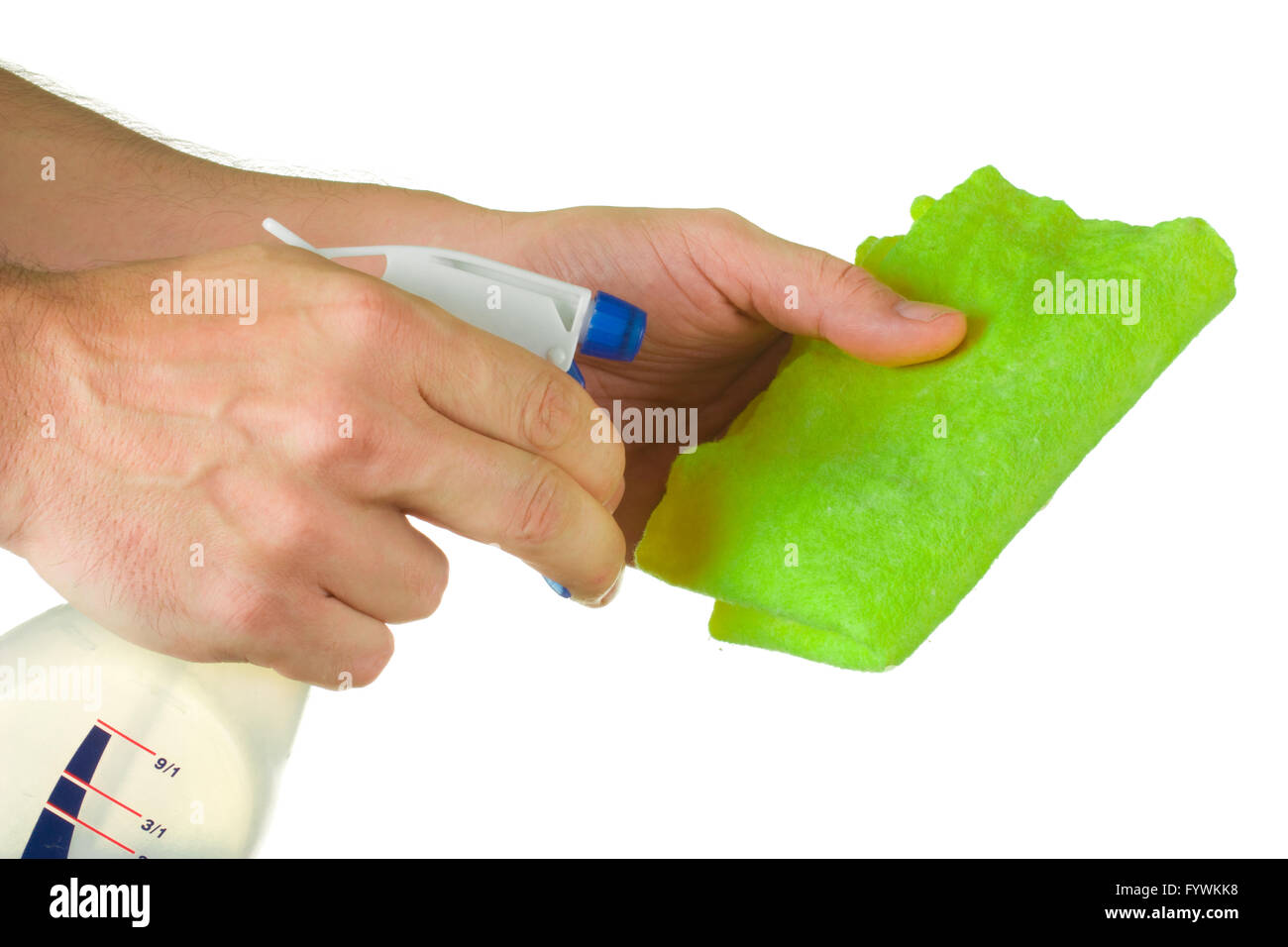 Hand with spray bottle and rag Stock Photo - Alamy