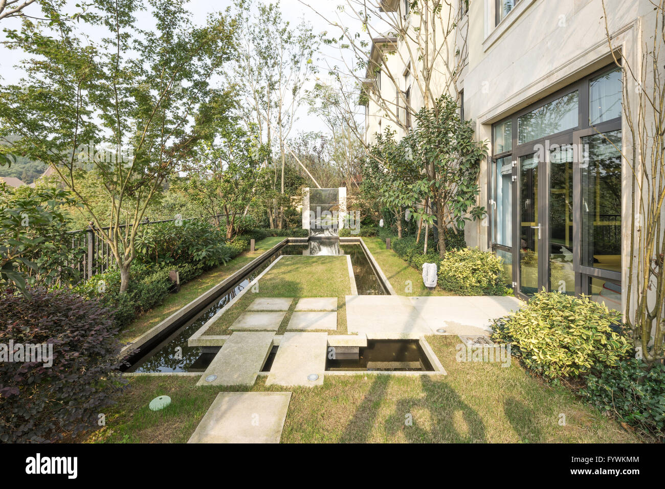 empty footpath through yard to modern building Stock Photo - Alamy