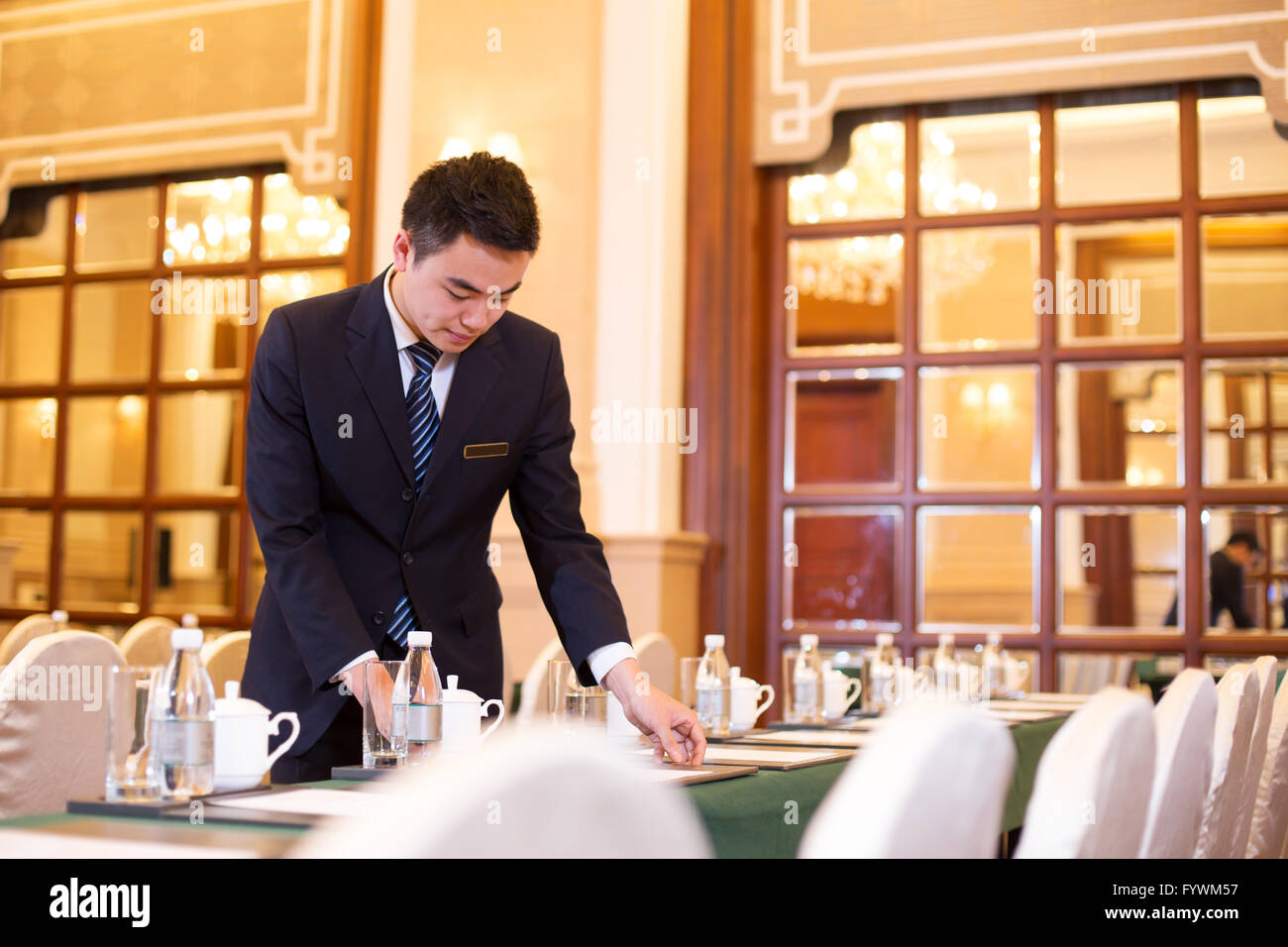 People setting hi-res stock photography and images - Alamy