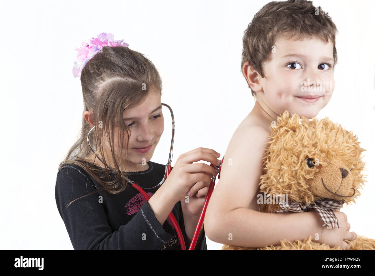 Boy girl playing doctor teddy hi-res stock photography and images - Alamy