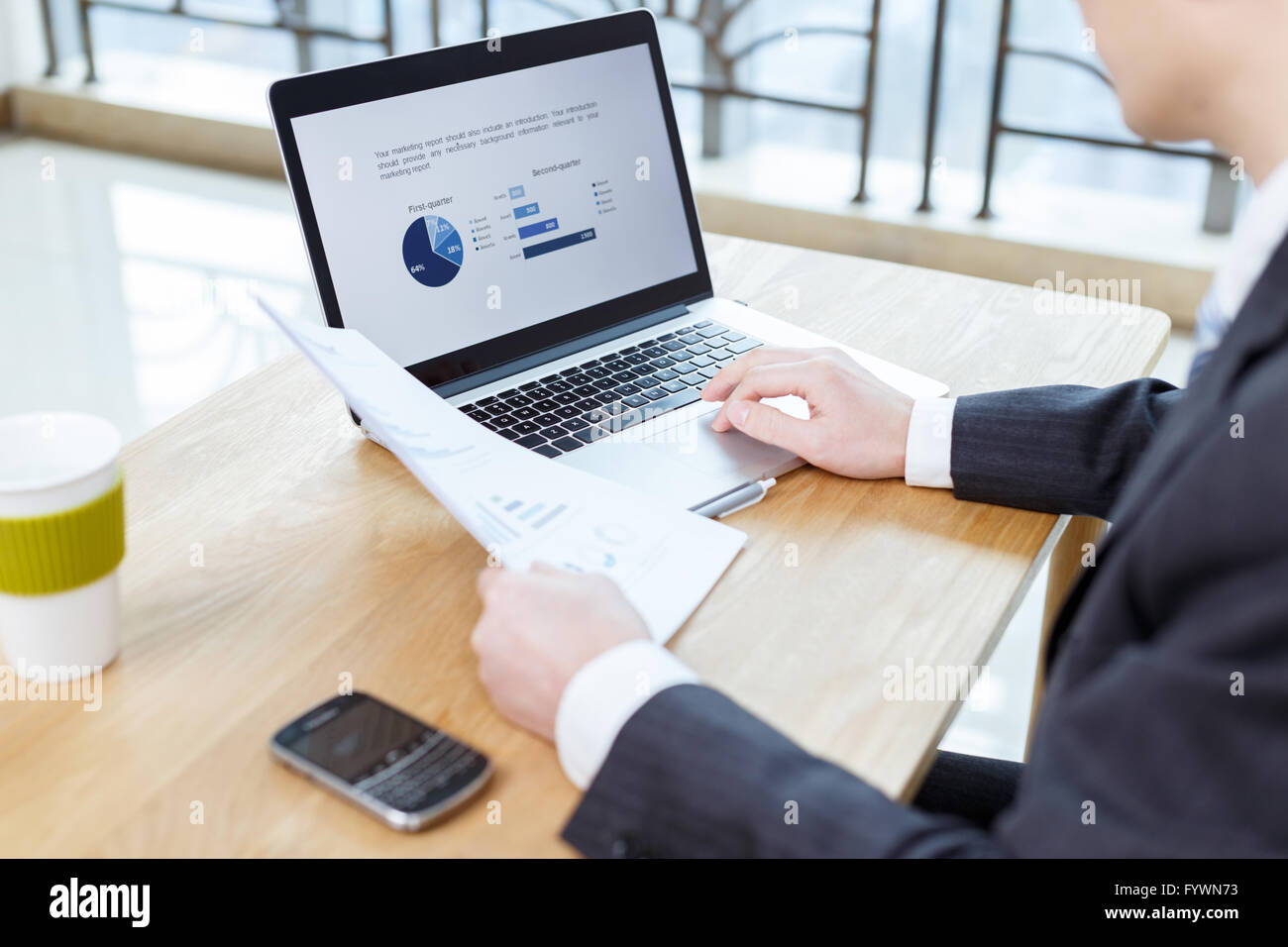 businessman checking financial reports Stock Photo - Alamy