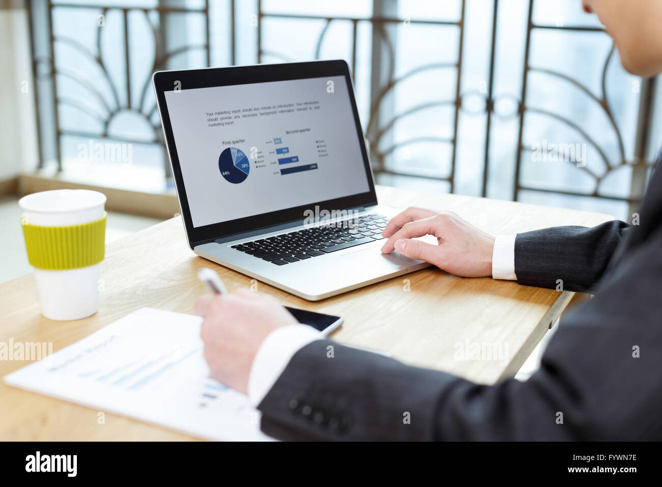 businessman checking financial reports Stock Photo - Alamy